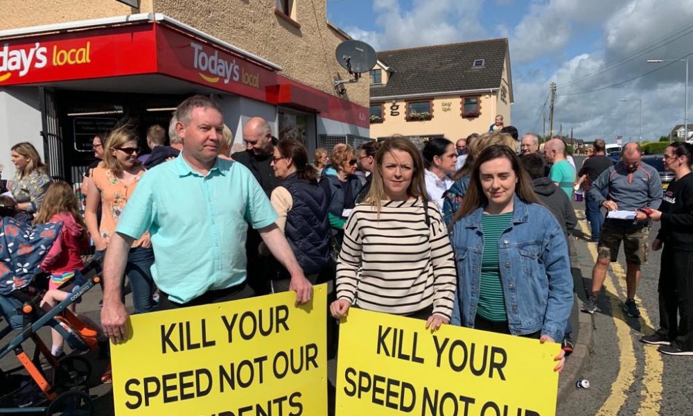 Residents stage community rally to demand motorists slow down before a ...